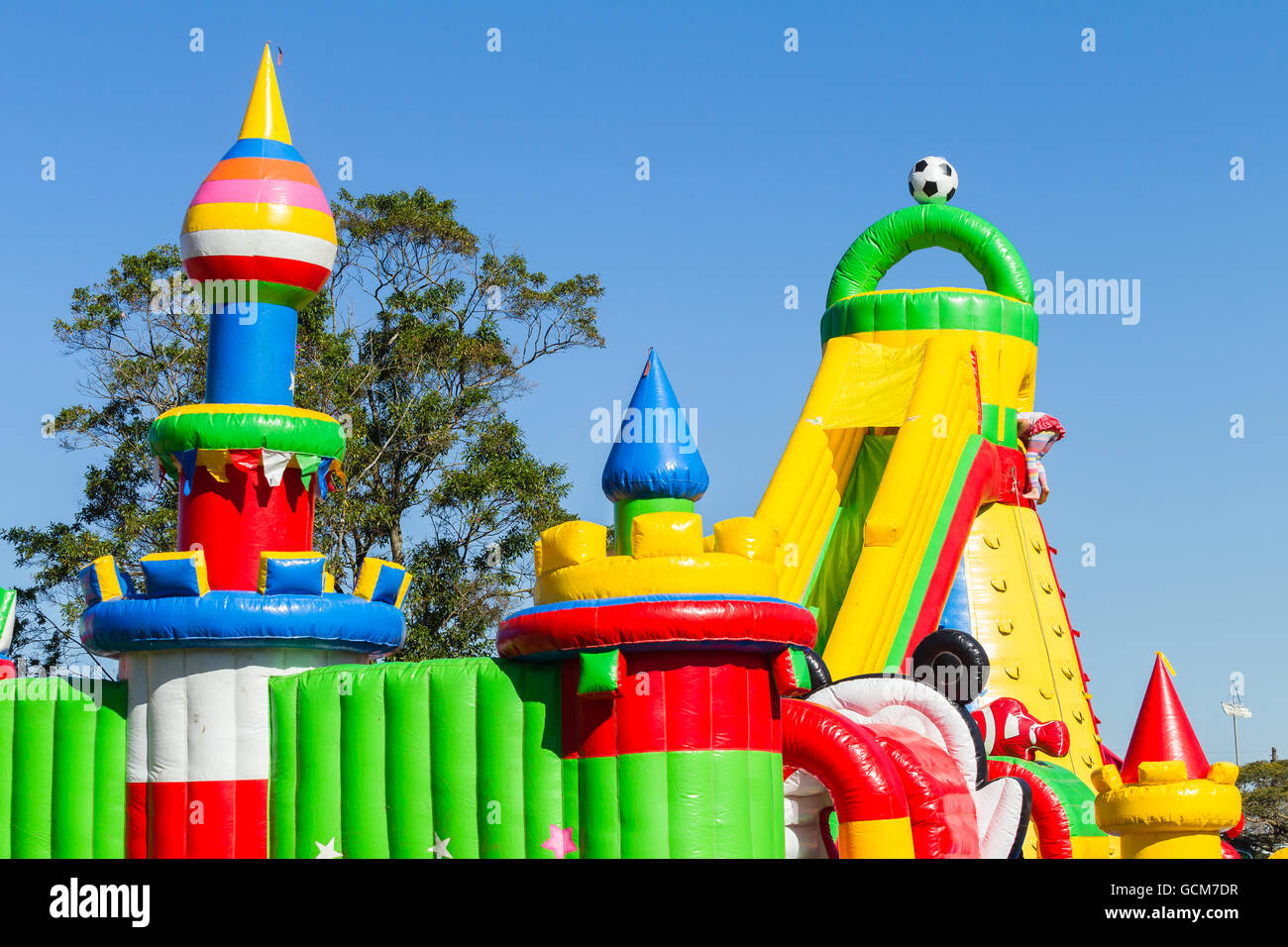 Playground inflatable castle children climbing top of slide holiday ...
