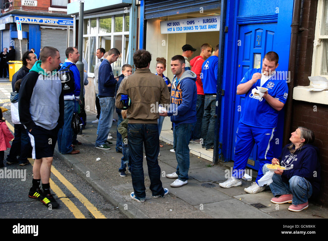 Everton fans eat food outside of Goodison Park prior to kick off Stock ...