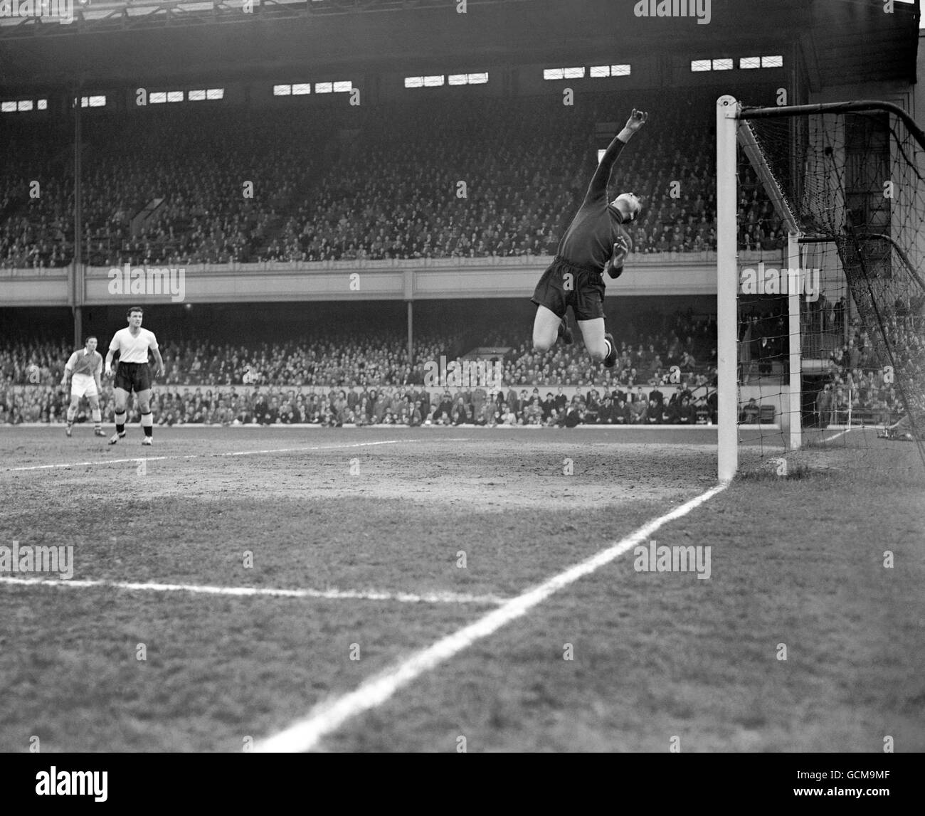 MacDonald, the Burnley goalkeeper makes a good save from Tiddy the ...