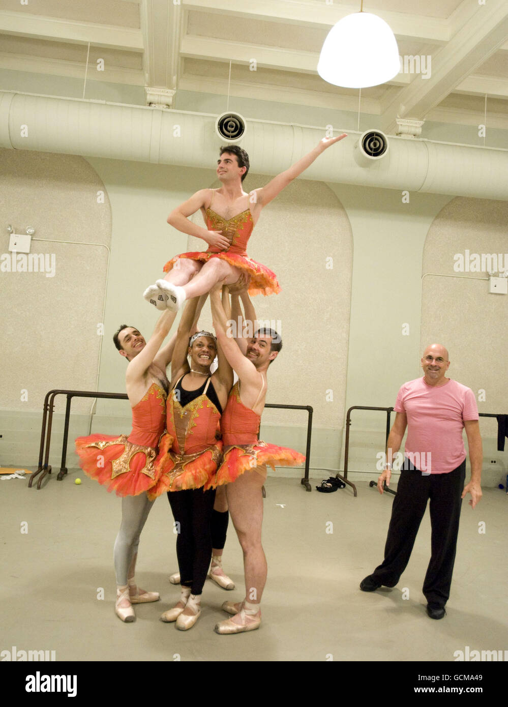 Times of London's Tim Teeman (held up by dancers) and artistic director ...