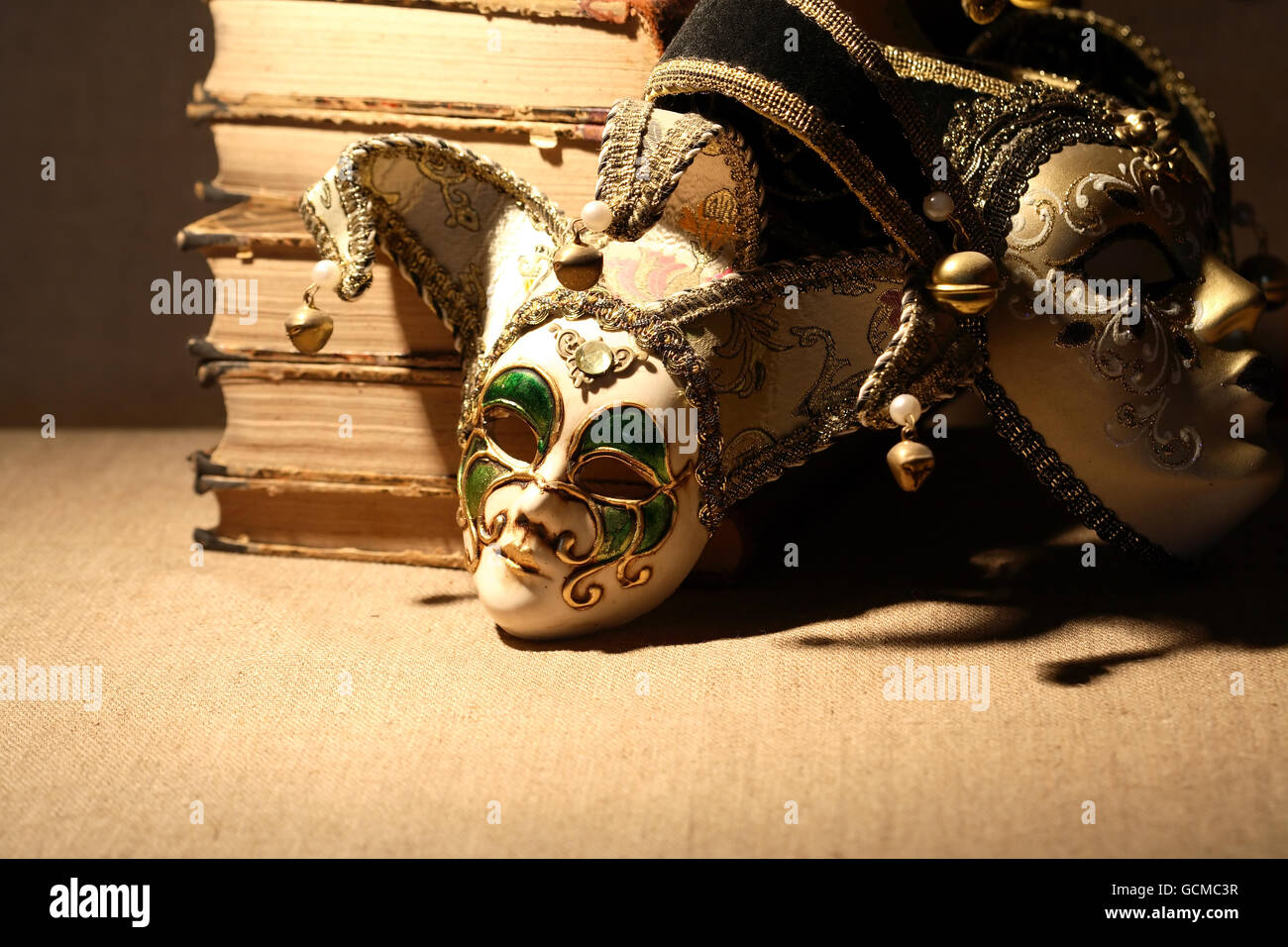 Art concept. Vintage still life with old books near masks Stock Photo ...