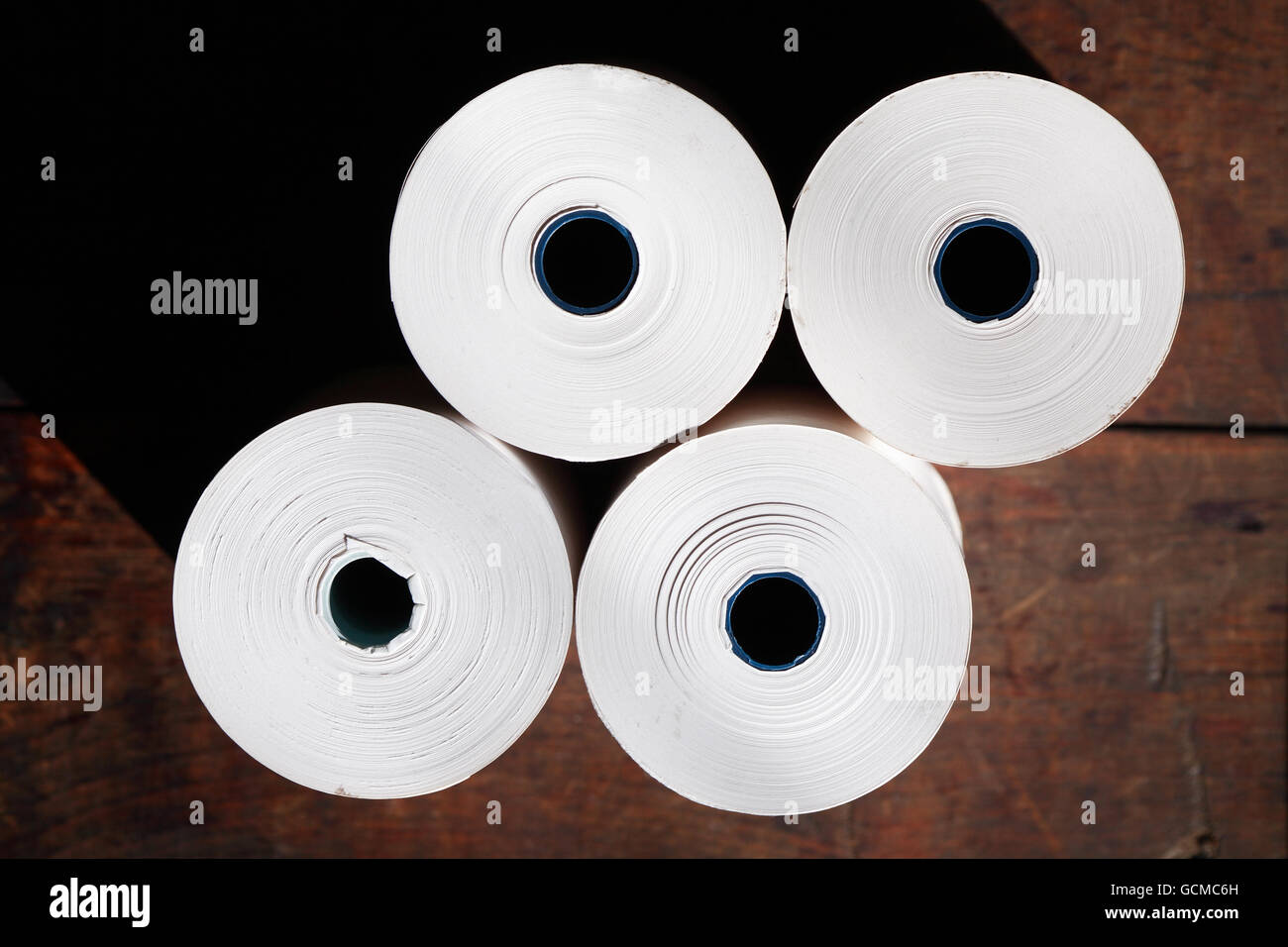 Set of white paper rolls closeup on wooden background Stock Photo - Alamy