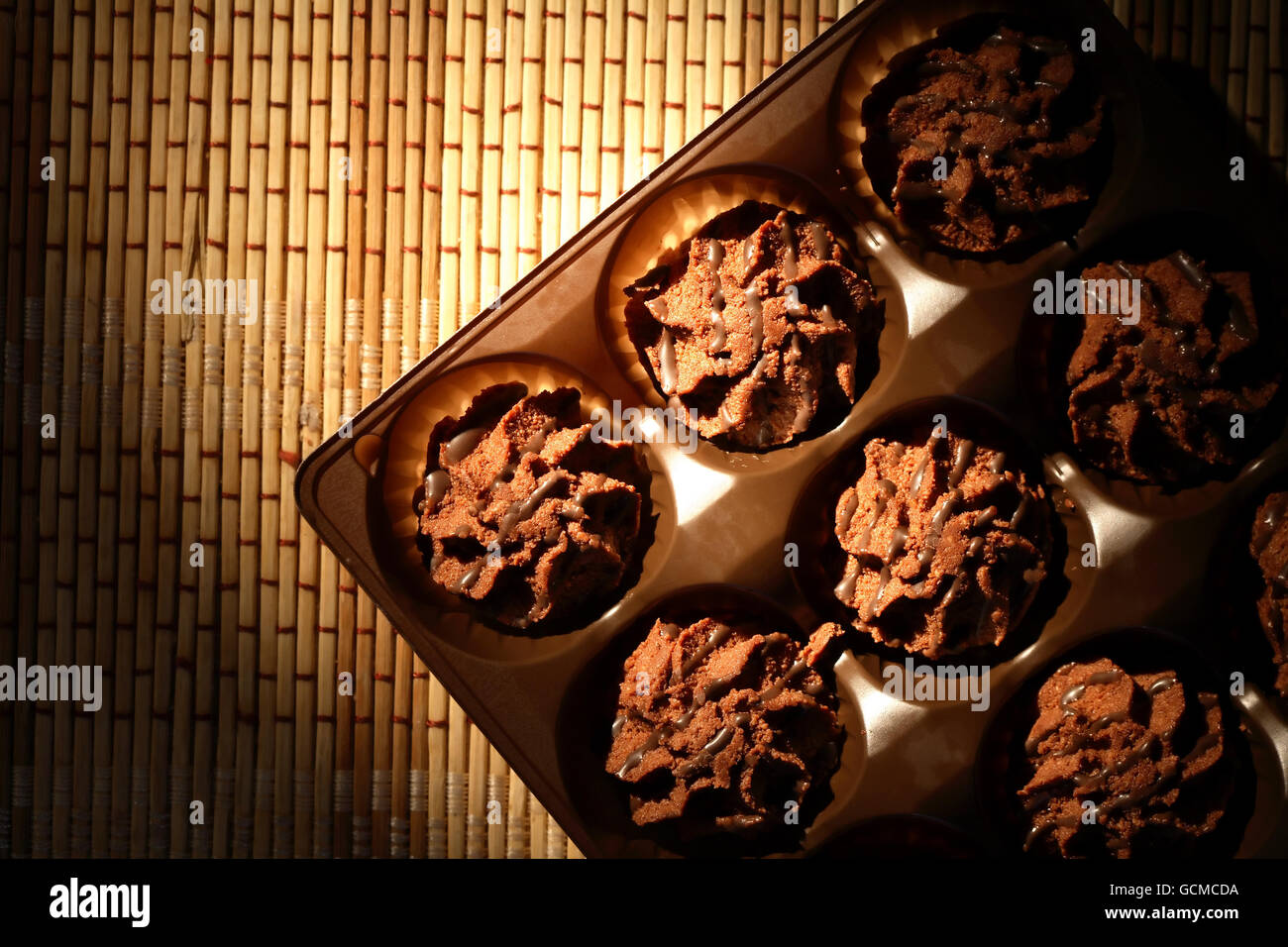 Open box with chocolate candies or pastry under beam of light Stock ...