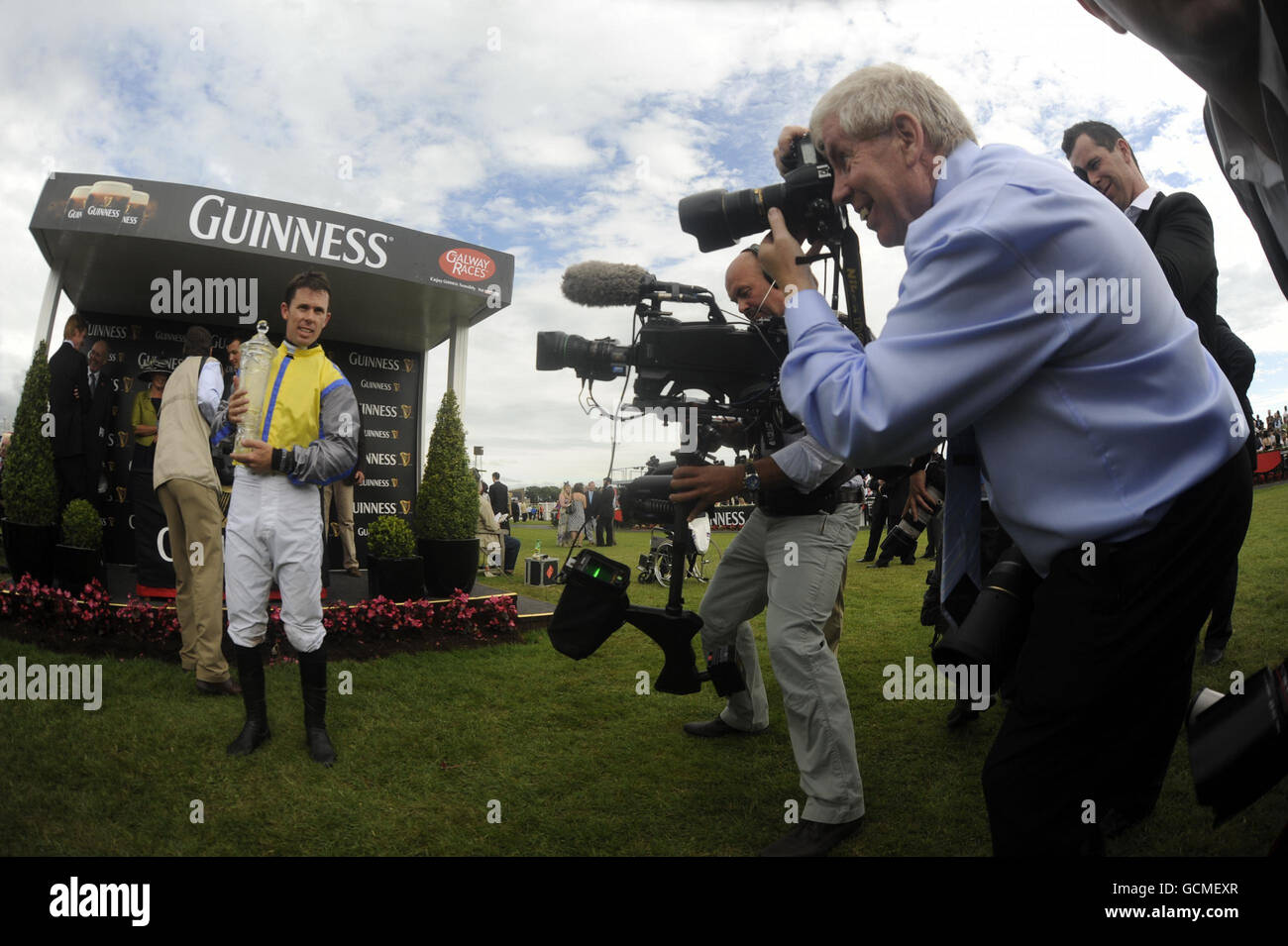 Gordon Lee celebrating with racing connections after riding Overturn to ...
