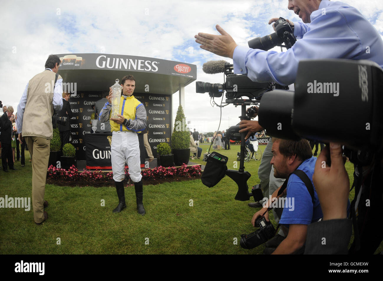 Gordon Lee celebrating with racing connections after riding Overturn to ...