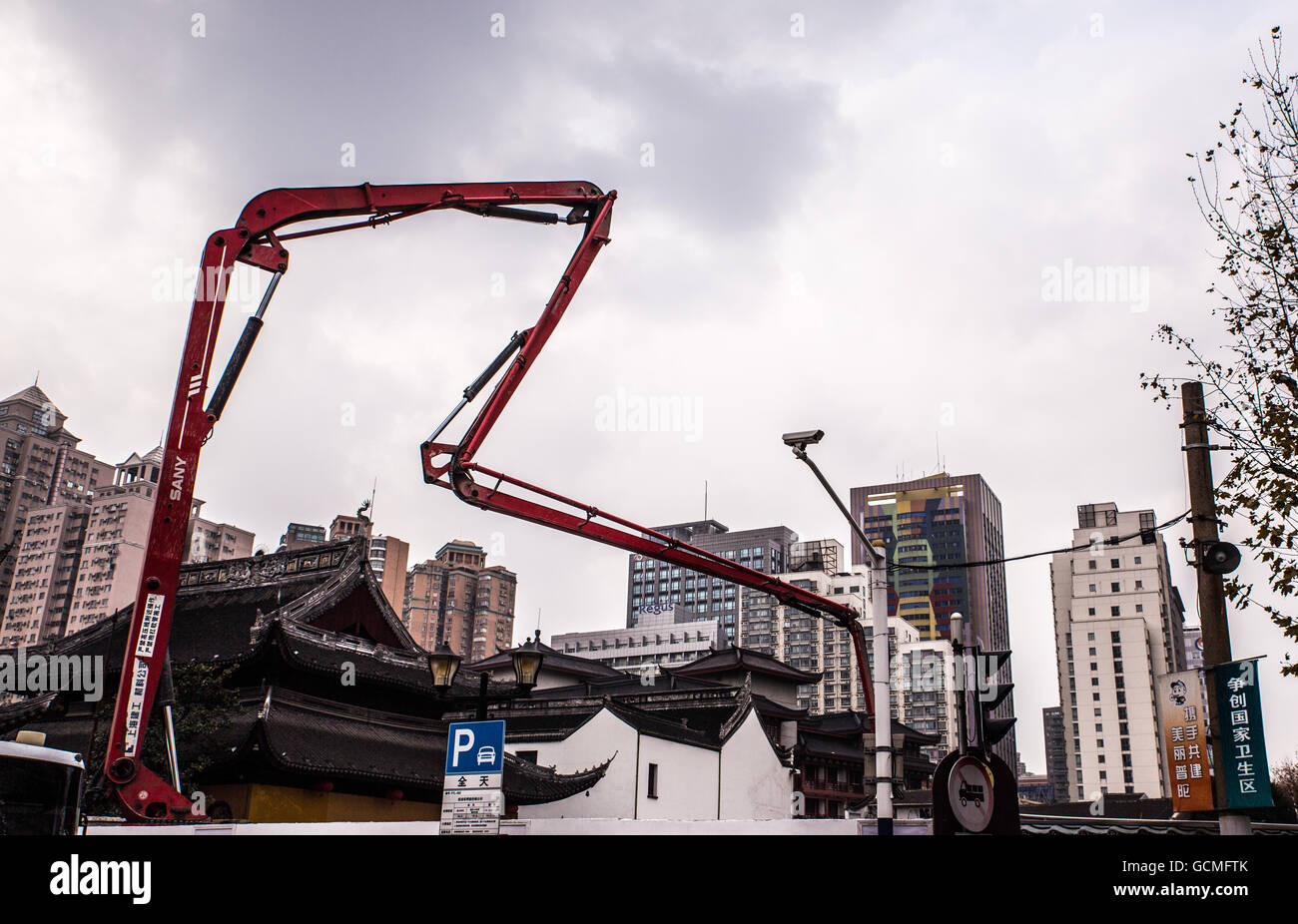 Construction site with skyscrapers and high towers old and modern in ...