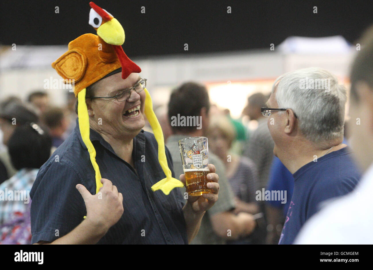 A man wearing a hat (name not given) holds a glass of beer at the Great ...