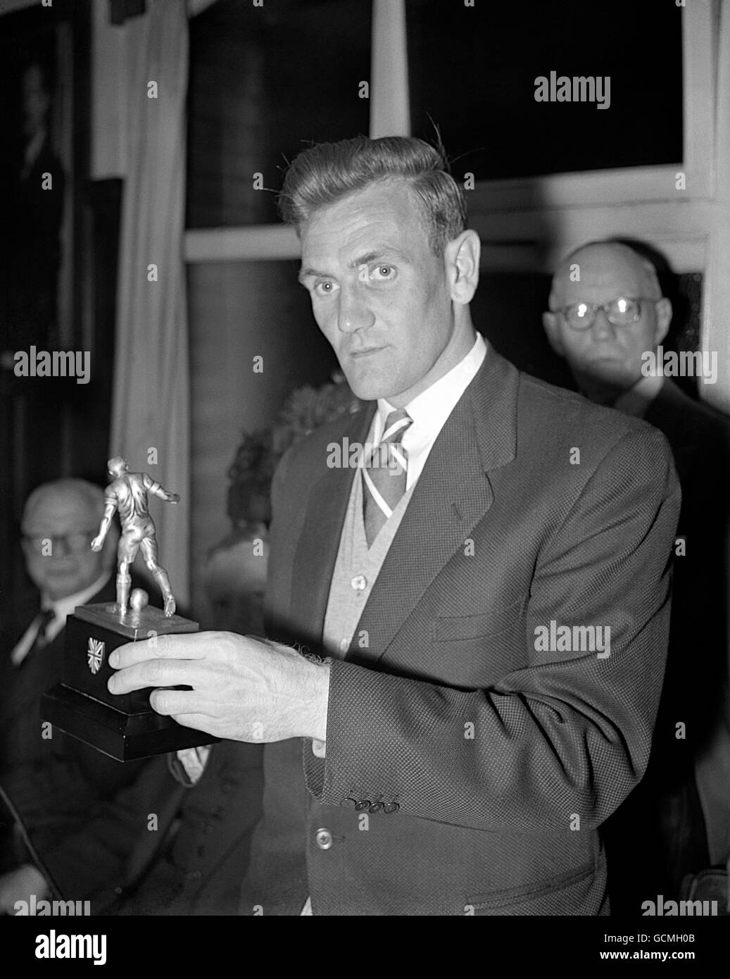 Proudly hugging his silver statuette trophy is Manchester City and ...