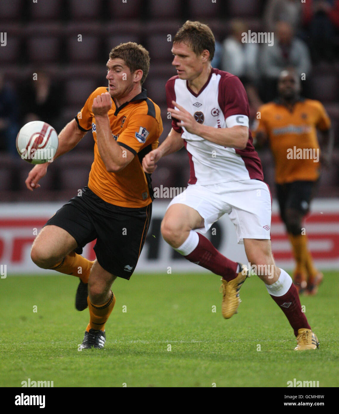Wolverhampton Wanderers Sam Vokes and Hearts' Marius Zaliukas battle ...