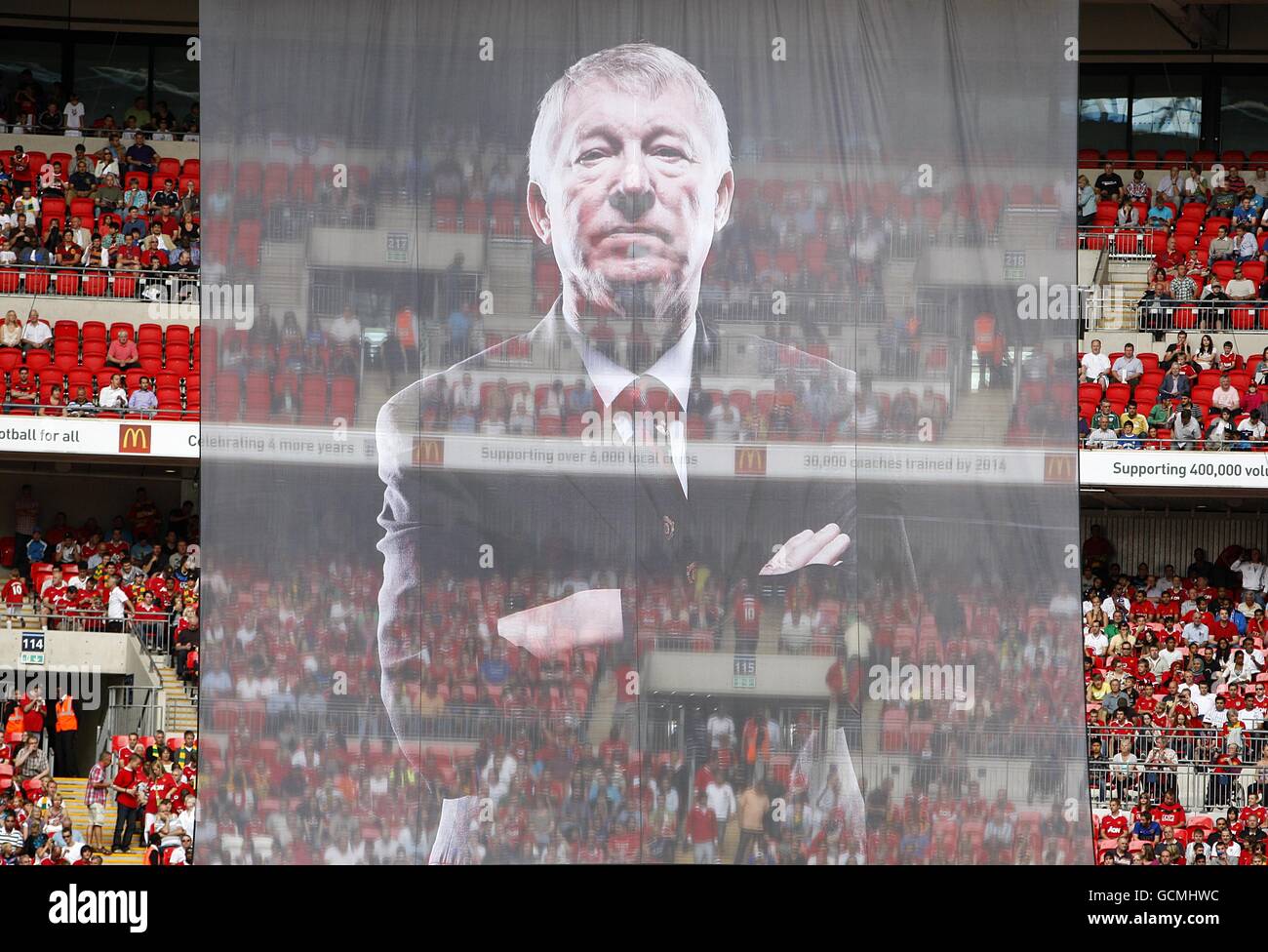 An image of Manchester United manager Alex Ferguson is seen on a banner ...