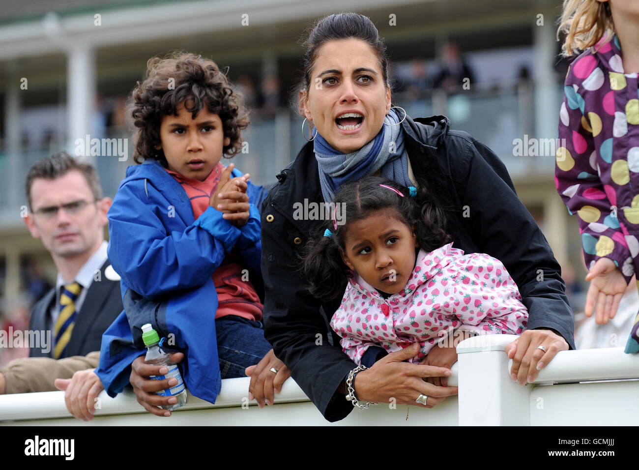 Children adults enjoying the racing on family fun race day hi-res stock ...