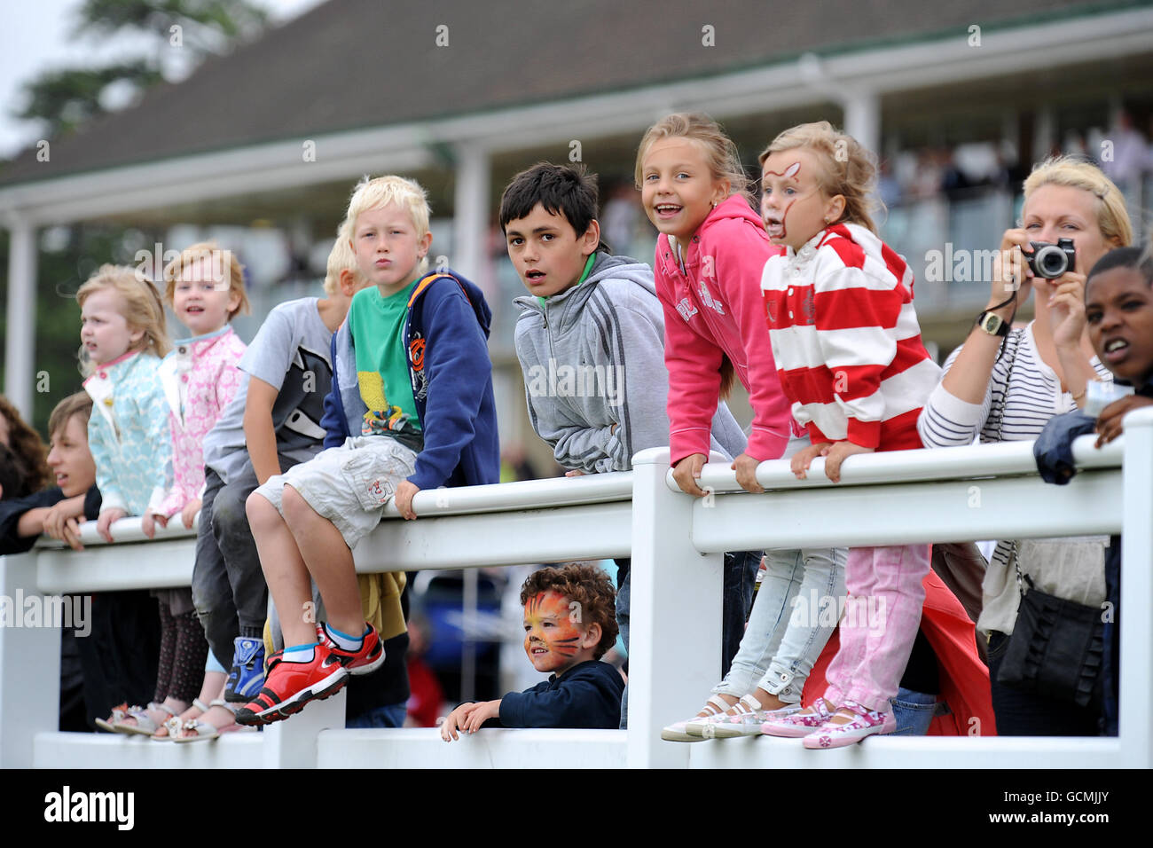 Children enjoying the racing on family fun race day hi-res stock ...
