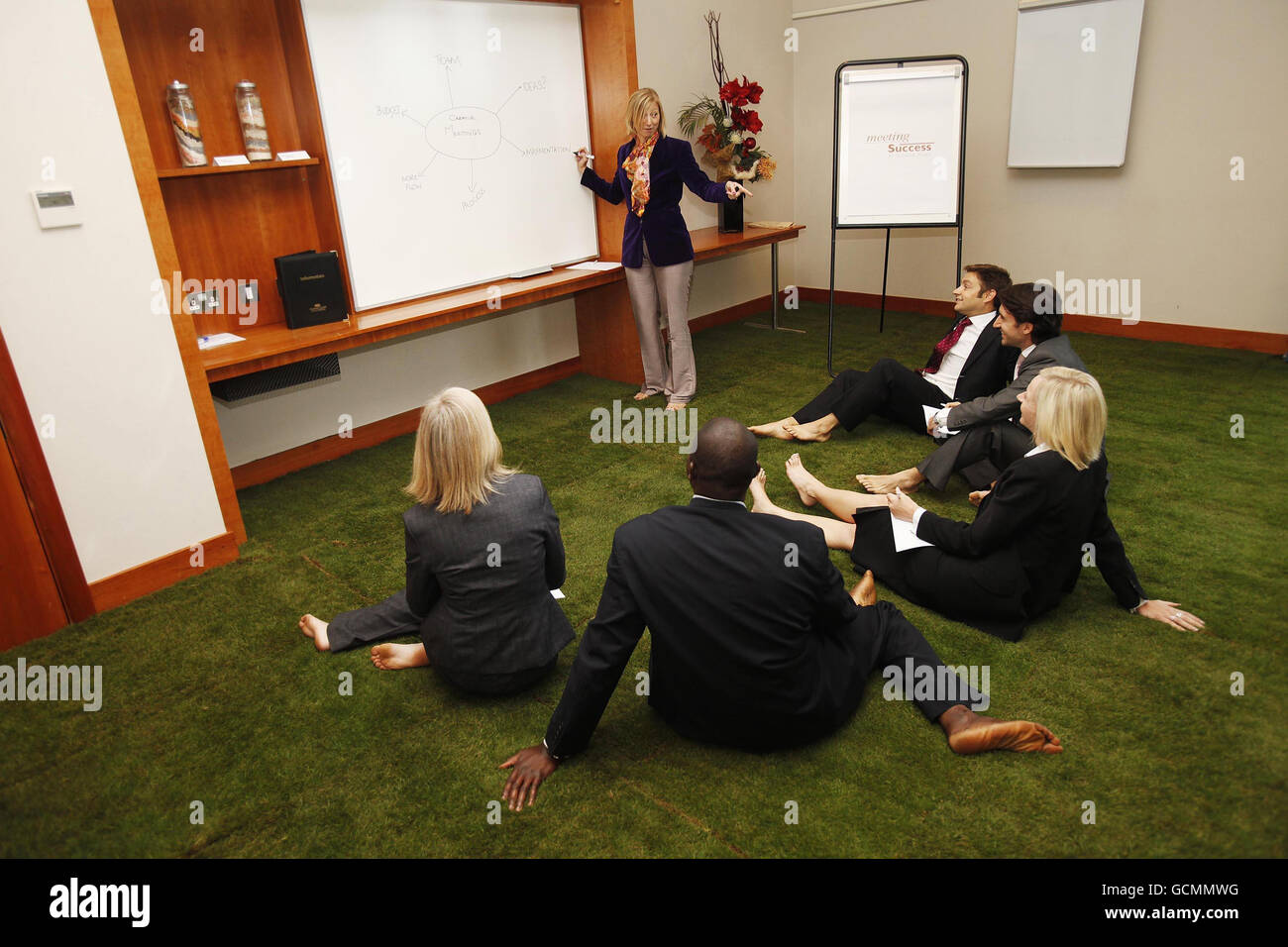 Business guests test out the new grass-turfed meeting room at Crowne ...