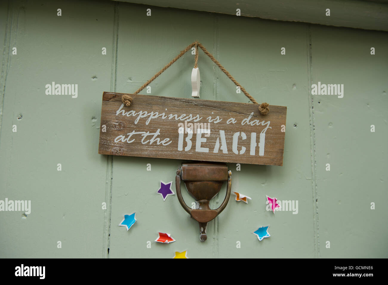 "Happiness is a day at the beach" Sign Hanging on a Door in the Resort ...