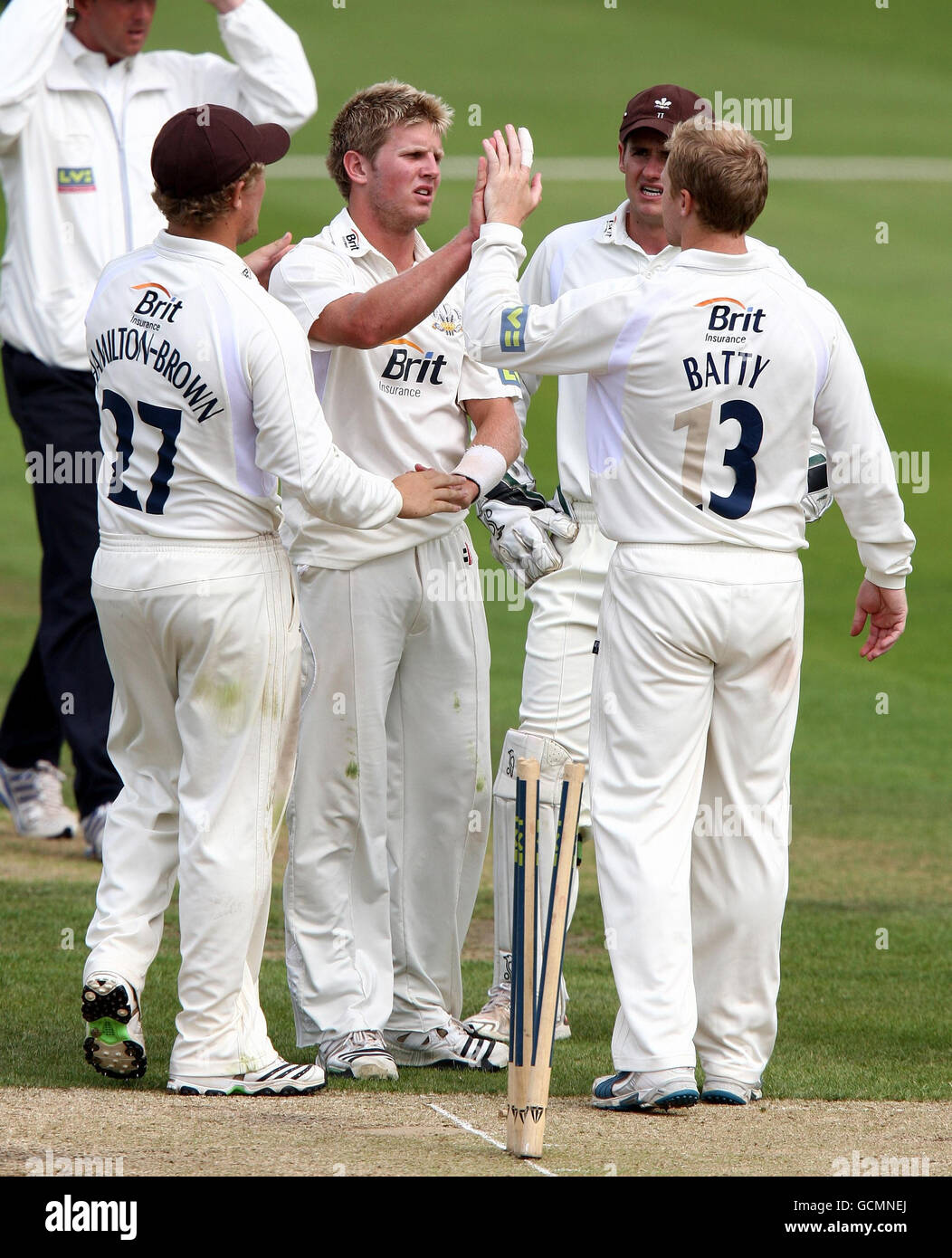 Surrey's Stuart Meaker celebrates taking the wicket of Worcestershire's ...