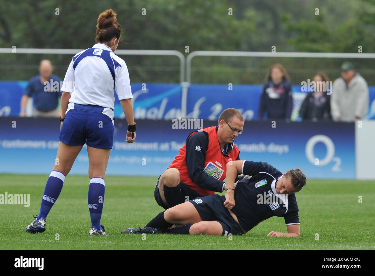 Scotland team doctor David Pugh (center) tends to Lucy Millard (floor ...