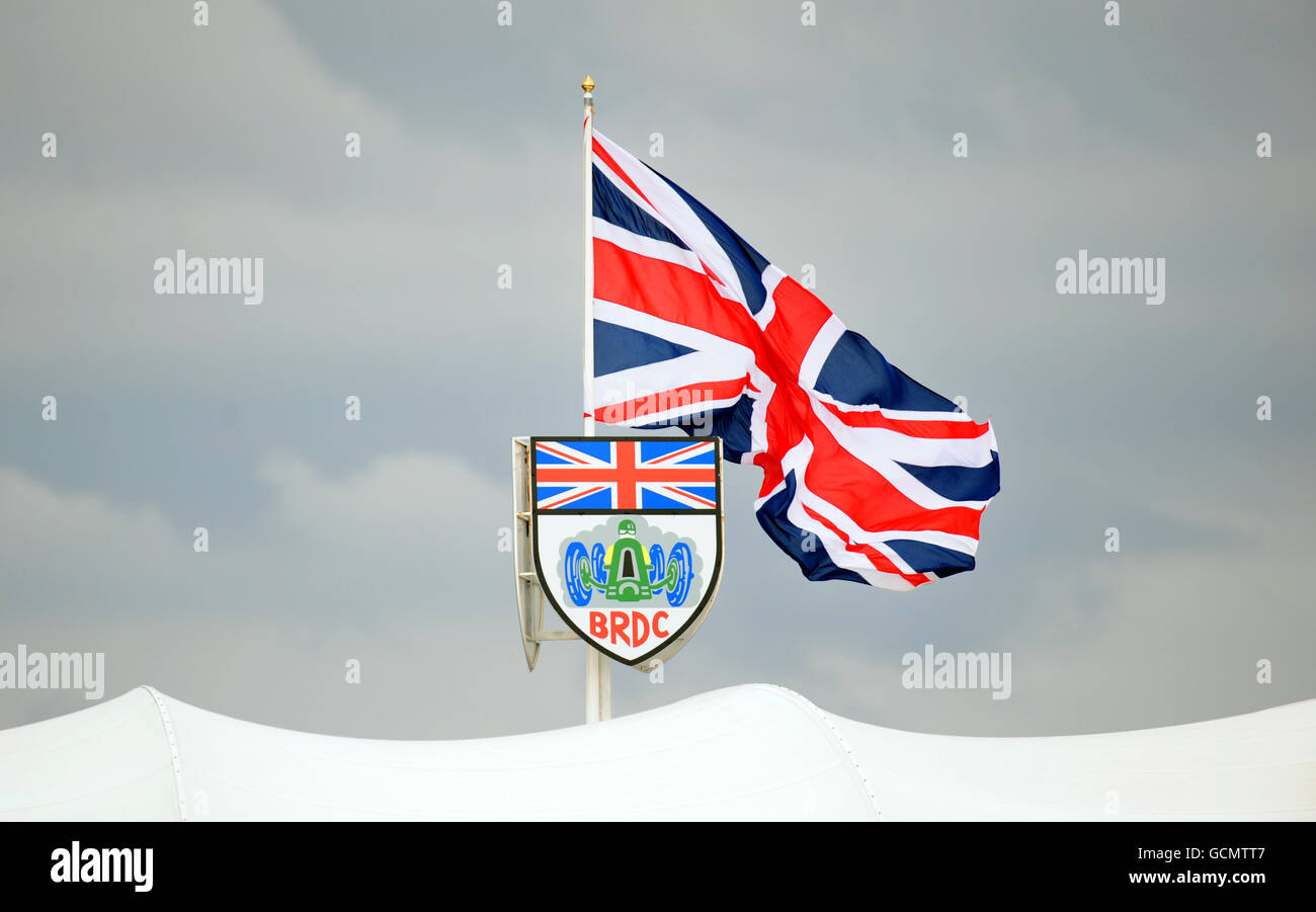 The Union Jack flag flies above a sign for the British Racing Drivers ...