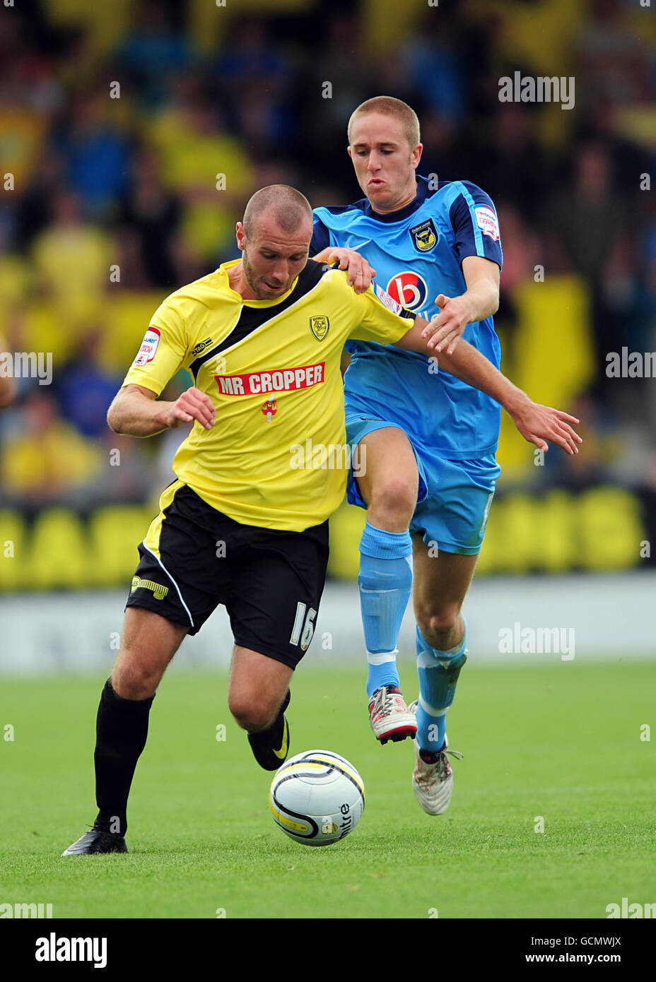 Burton Albion's Russ Penn (left) and Oxford United's Asa Hall battle ...