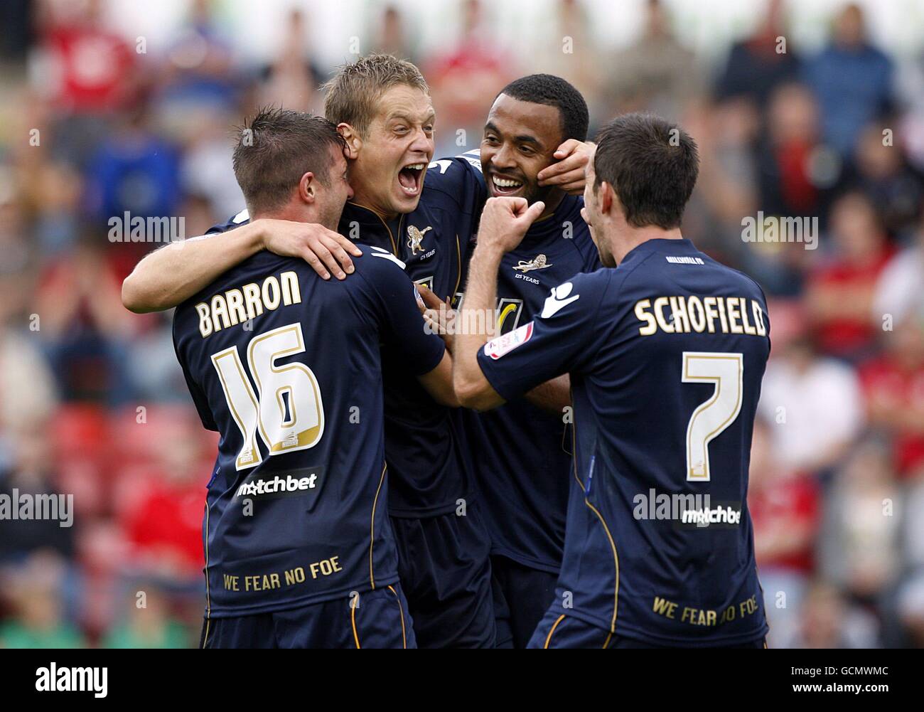 Millwall's Paul Robinson (second left) celebrates scoring his sides ...