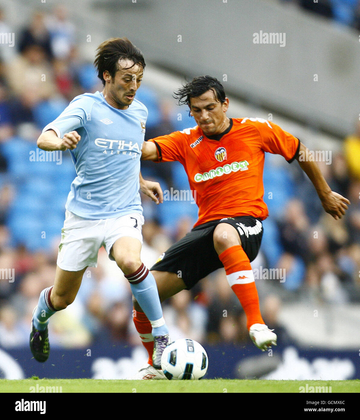 Manchester citys david silva and valencias mehmet topal hi-res stock ...