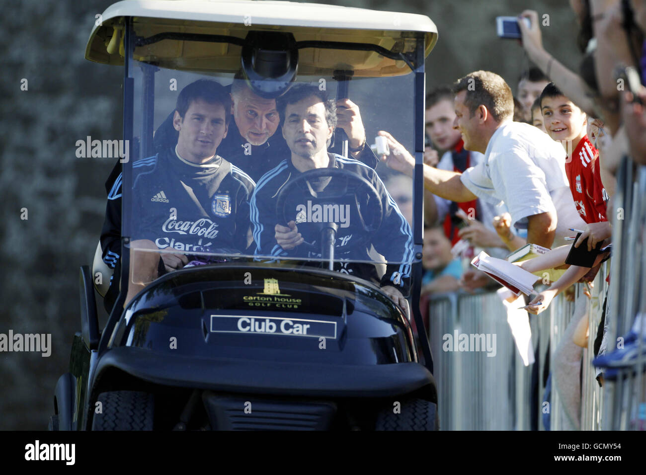 Argentina's Lionel Messi (left) is photographed by waiting fans as he ...