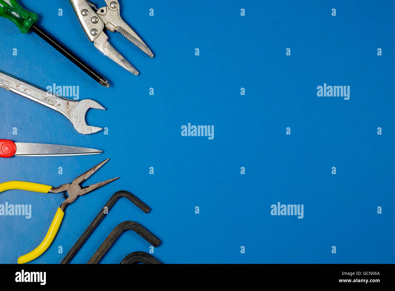 Tools on blue table for background Stock Photo - Alamy