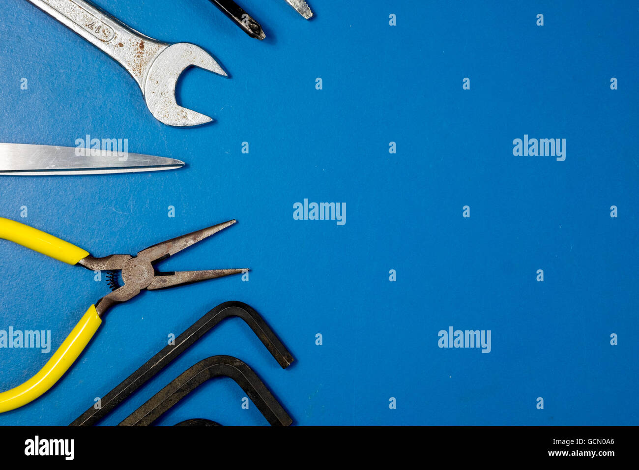 Tools on blue table for background Stock Photo - Alamy
