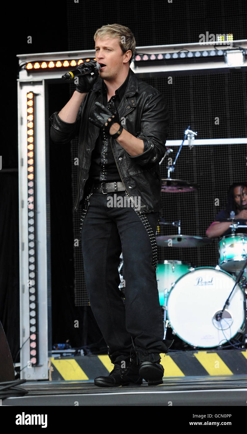 Kian Egan of Westlife performs on stage during Ladies Day at Newbury ...
