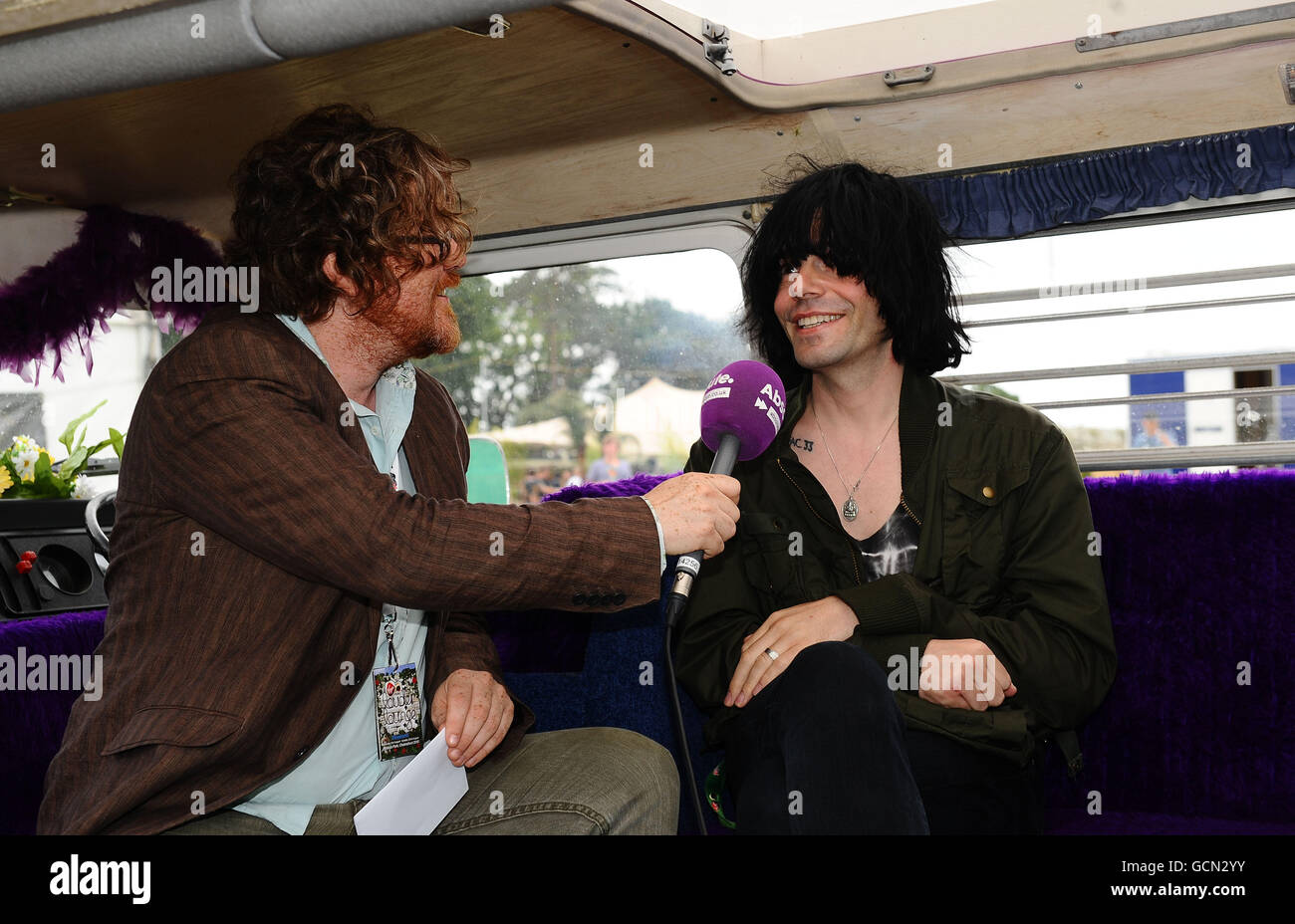 Geoff Lloyd (left) speaks to Tim Burgess of the Charlatans, backstage ...