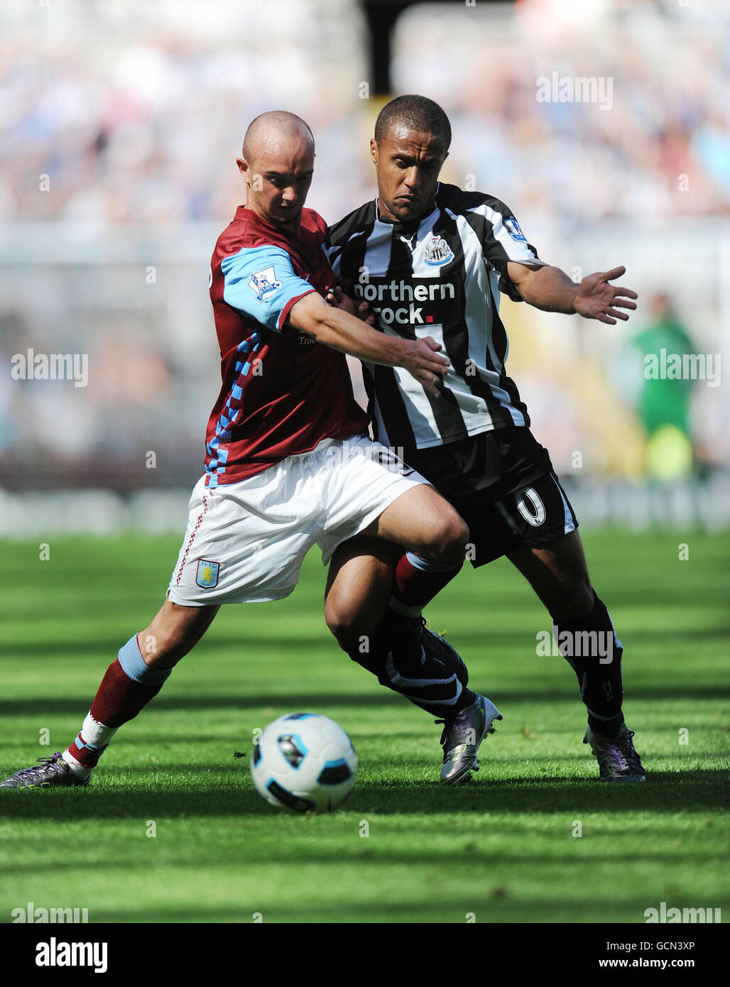 Aston Villa's Stephen Ireland (left) in action with Newcastle United's ...