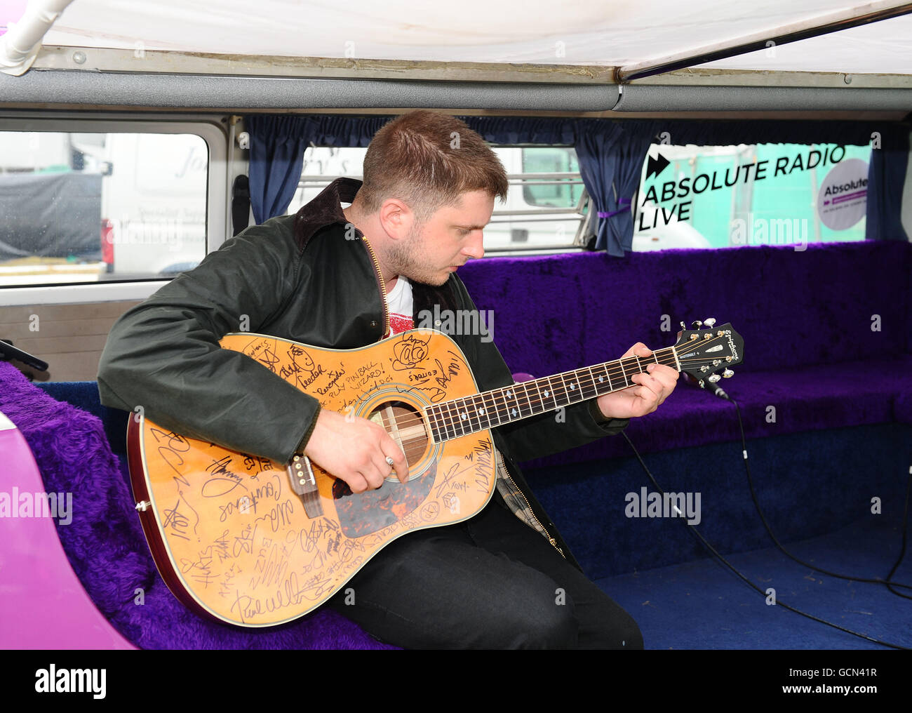 Ben Drew aka Plan B plays backstage at the Absolute Radio VIP area ...