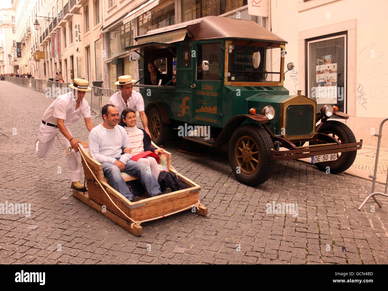 the traditional baskets of Madeira on a road in the city centre of ...