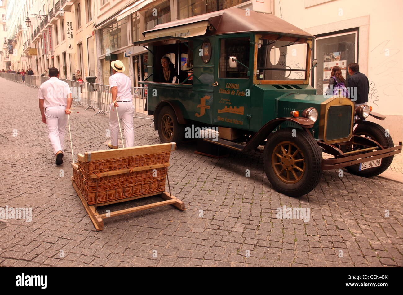 the traditional baskets of Madeira on a road in the city centre of ...