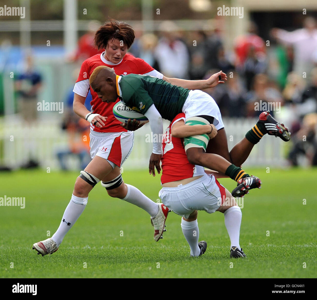 South Africa's Lamla Momoti (centre) is upended by Wales' Ceri Redman ...