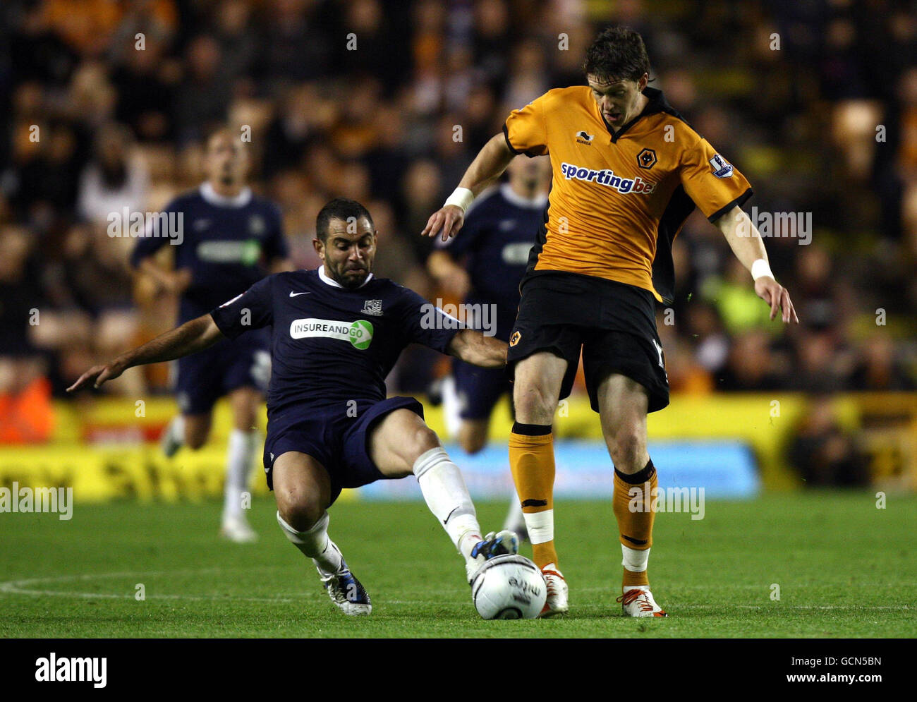 Soccer wolves full length tackling mangkk datacoapplies hi-res stock ...