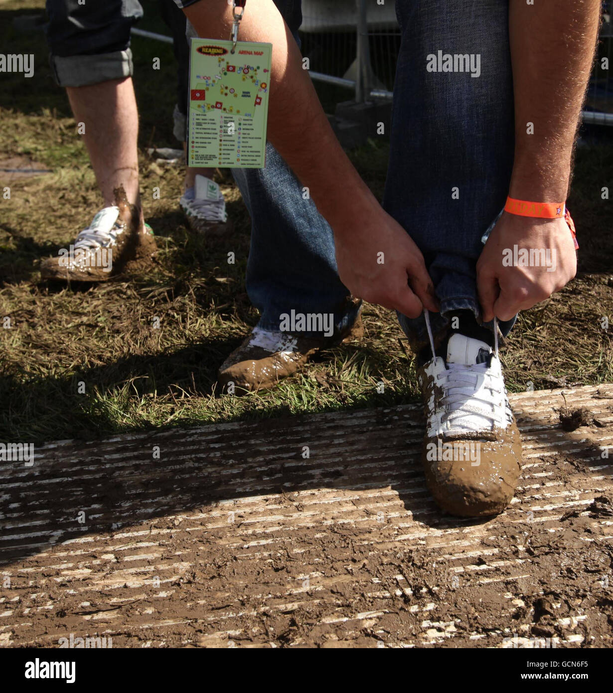 Festival goers in the muddy conditions on the first day of the Reading ...