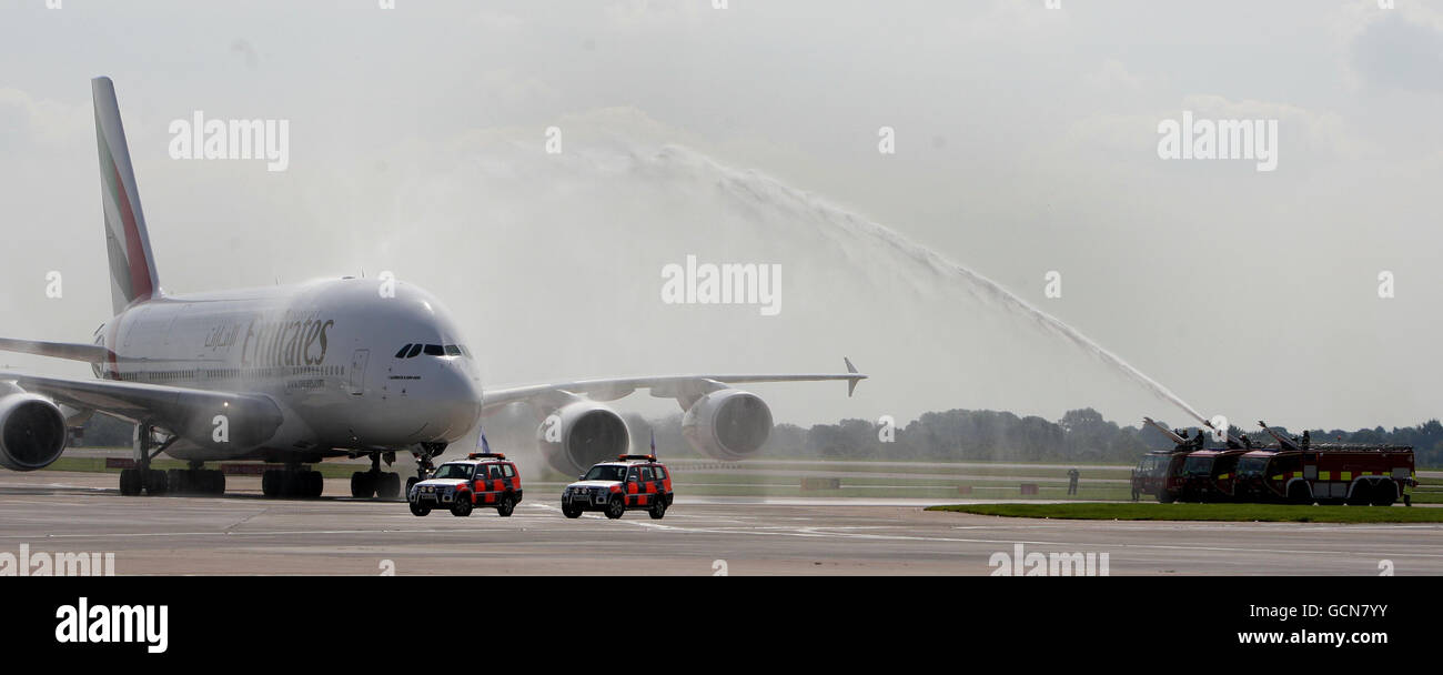 An Emirates Airbus A380 in sprayed with water at it lands at Manchester ...