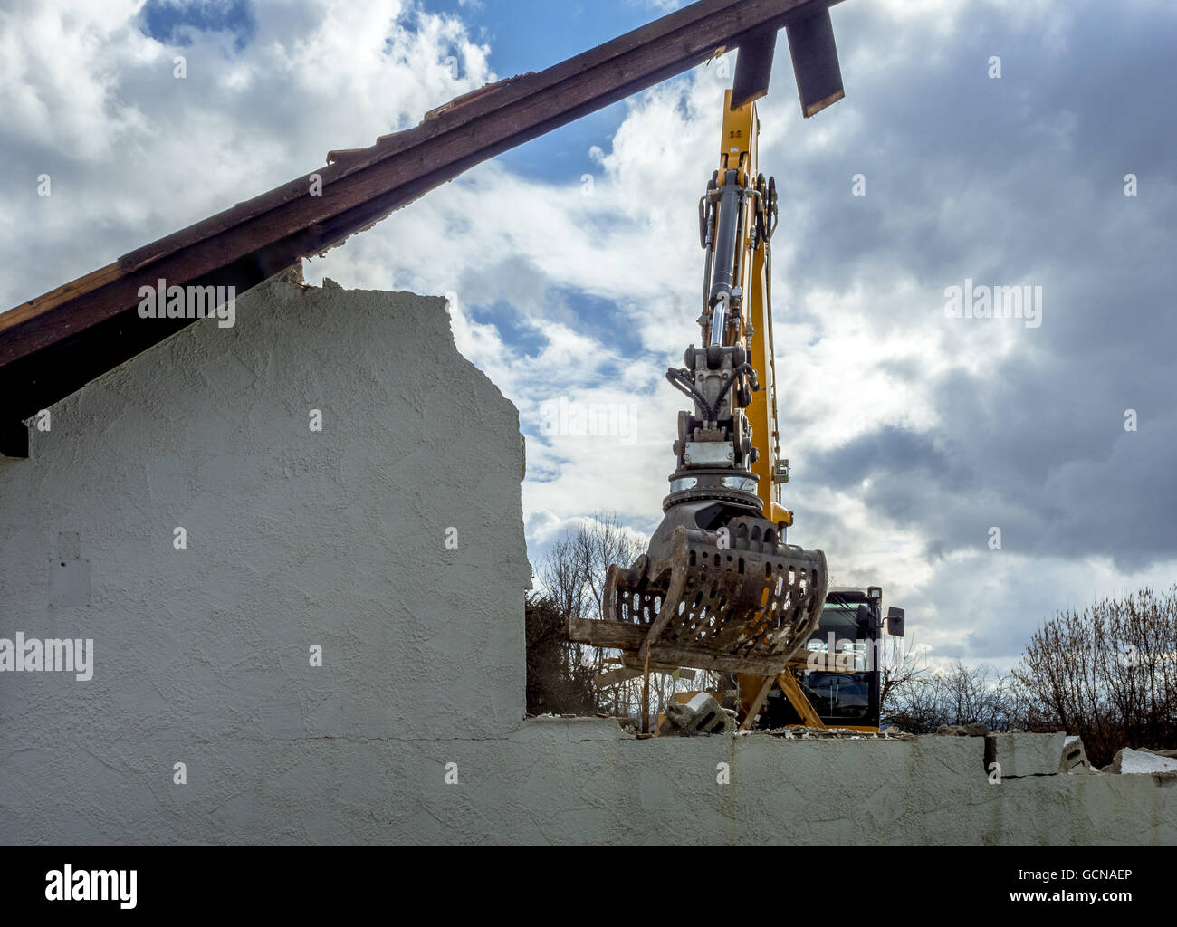 Excavator demolishing house bavaria hi-res stock photography and images ...