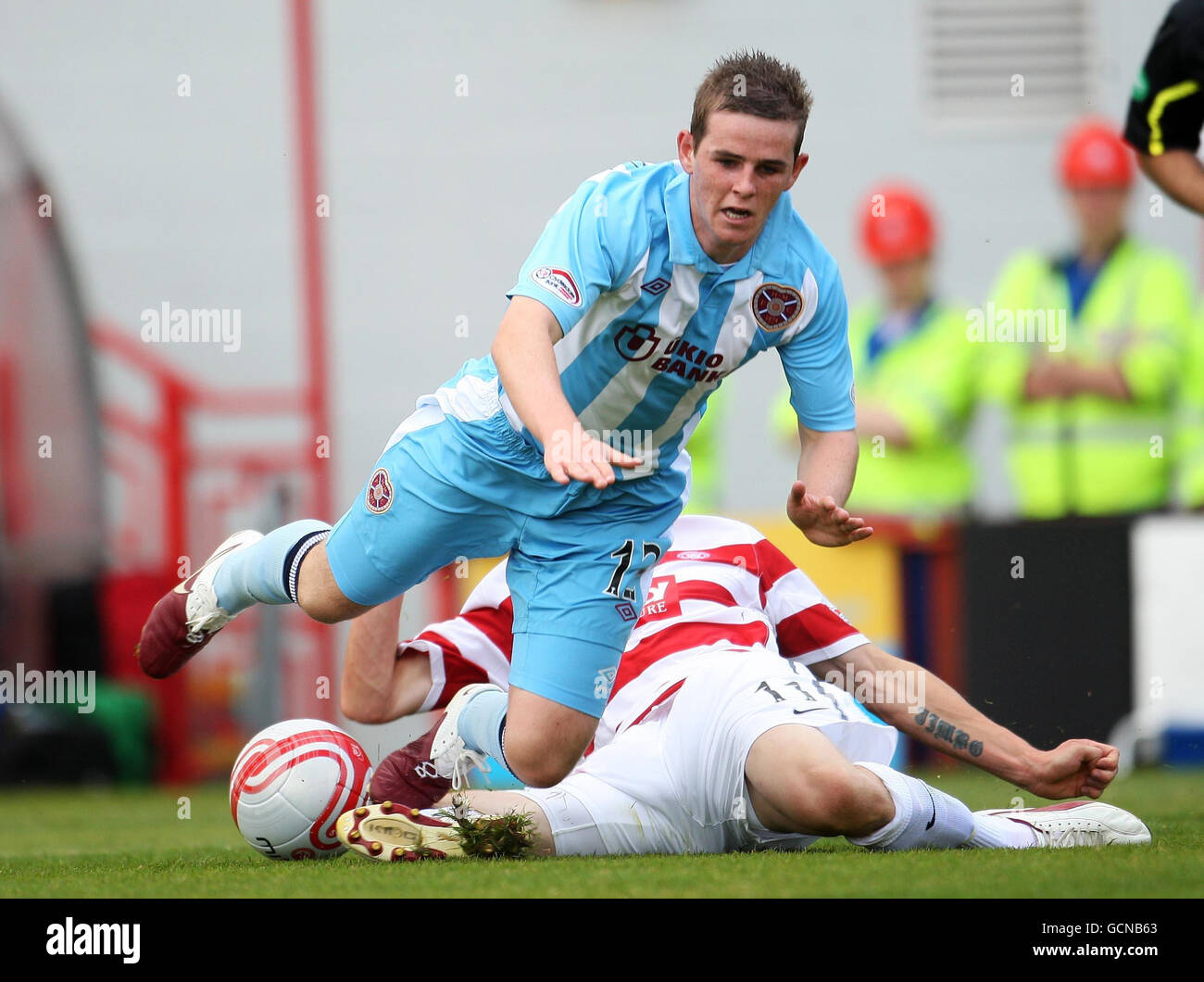 Hamilton's James McAlister and Hearts David Templeton (left) battle for ...