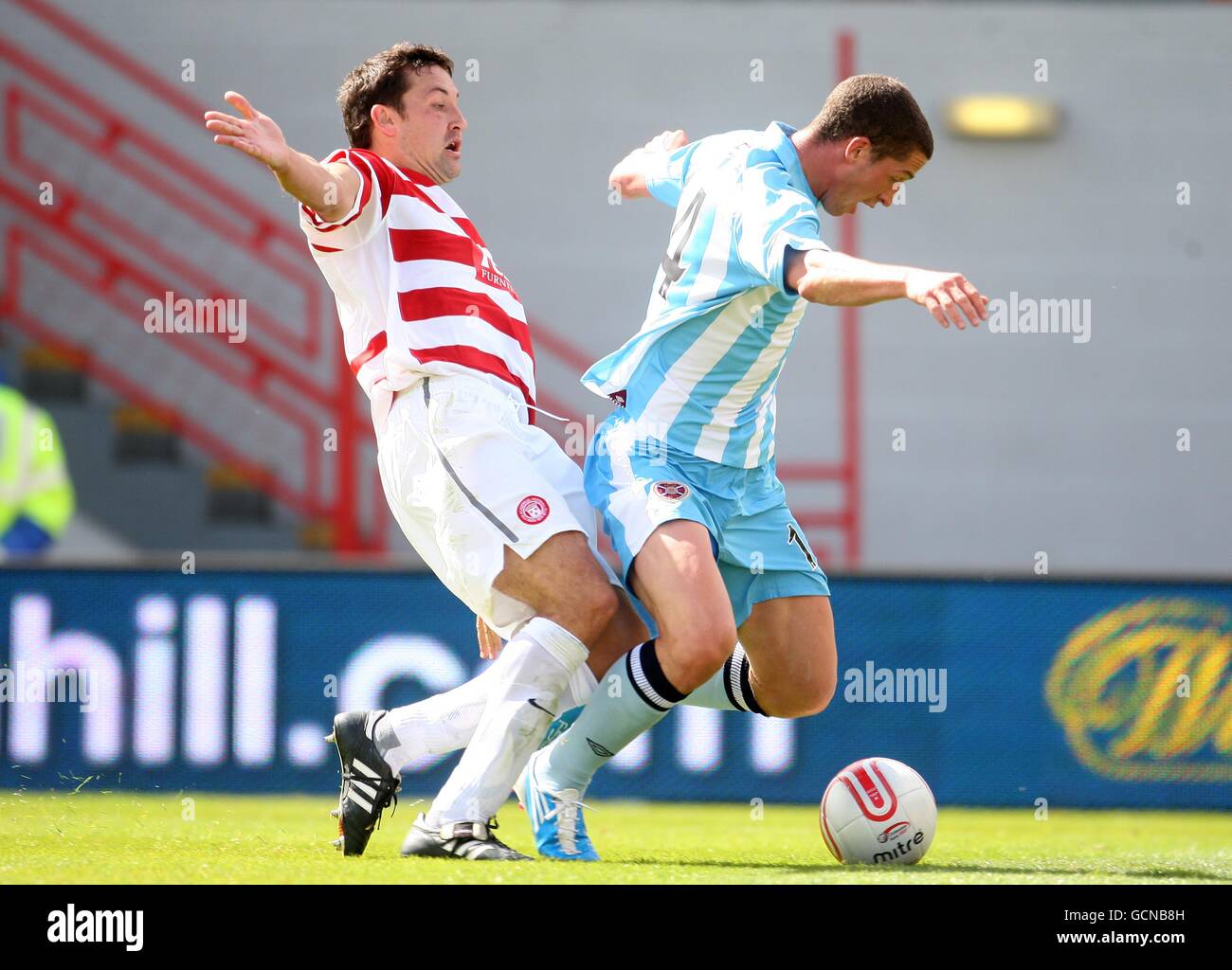 Hearts Callum Elliot is fouled by Hamilton's Martin Canning who is sent ...