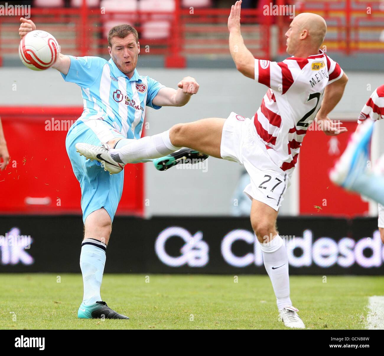 Hearts Kevin Kyle and Hamilton's Simon Mensing battle for the ball ...