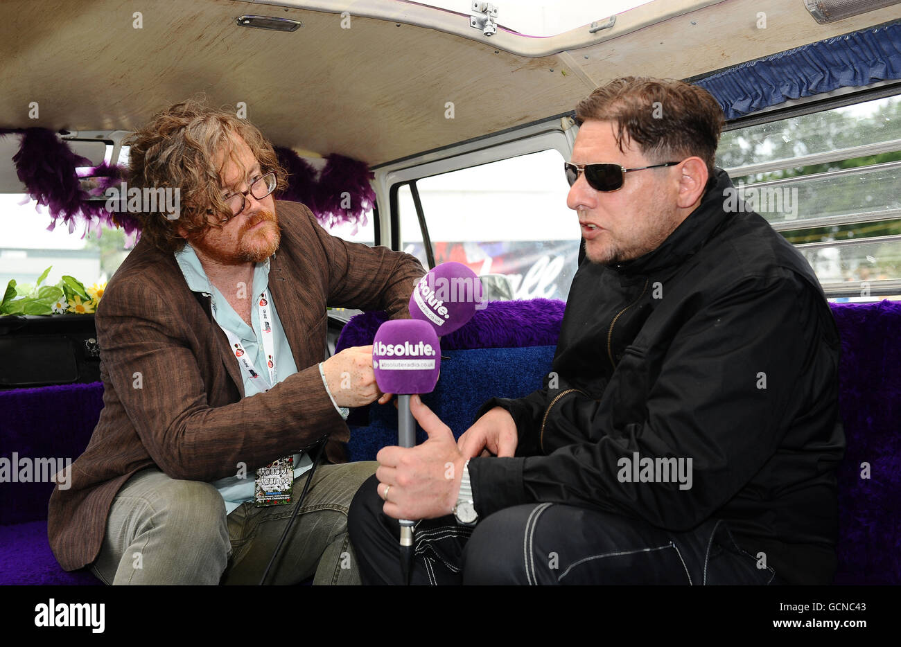 Geoff Lloyd (left) speaks to Sean Ryder backstage at the Absolute Radio ...