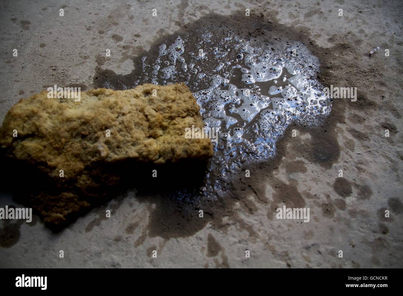 Sponge And Water Puddle Stock Photo - Alamy
