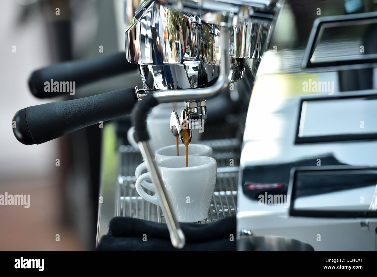 Espresso coffee maker - barista style Stock Photo - Alamy