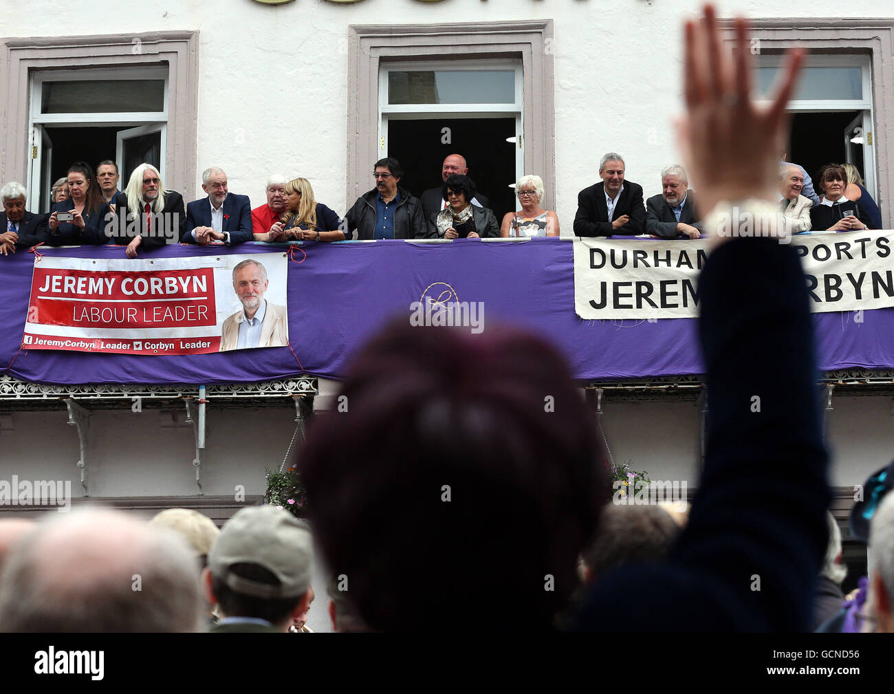 Labour Party leader Jeremy Corbyn, standing above a banner of himself ...