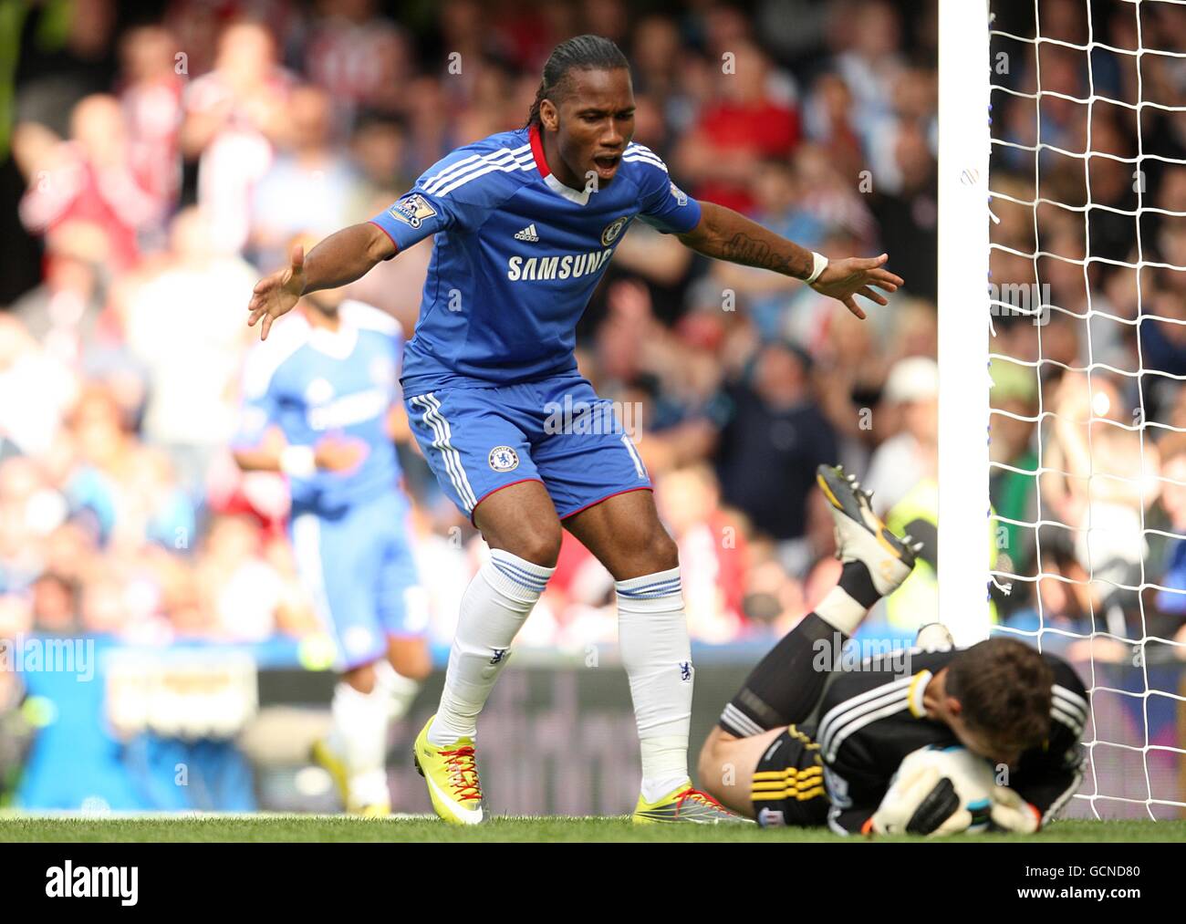Chelsea's Didier Drogba (left) reacts after his shot on goal is saved ...