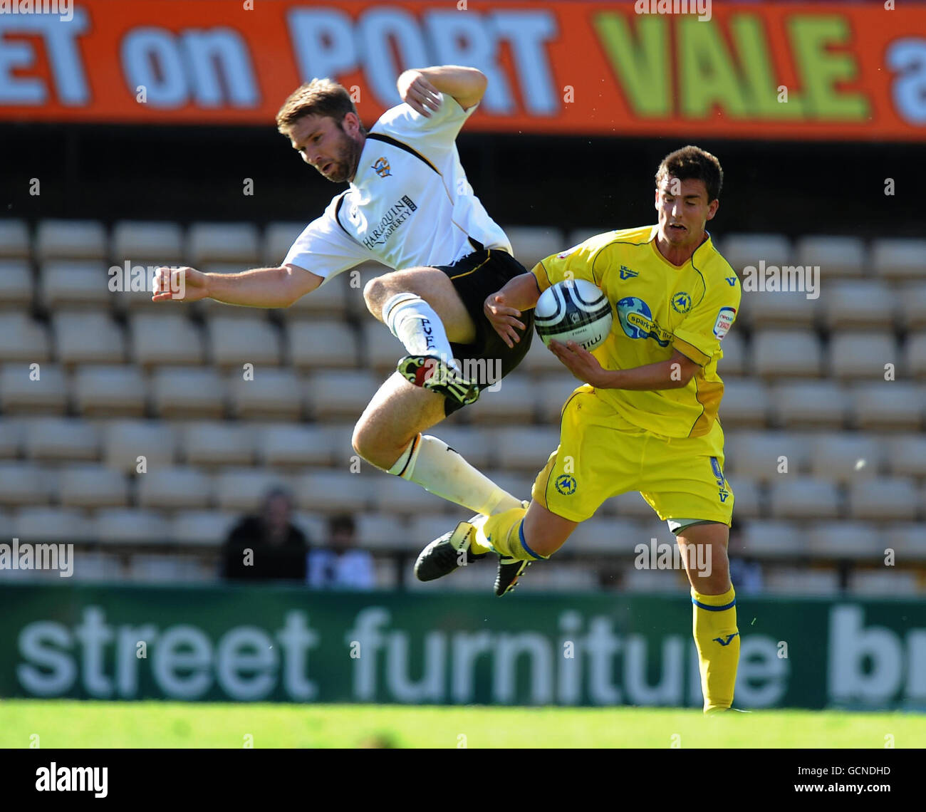 Port Vale's John McCombe and Torquay United's Elliot Benyon battle for ...