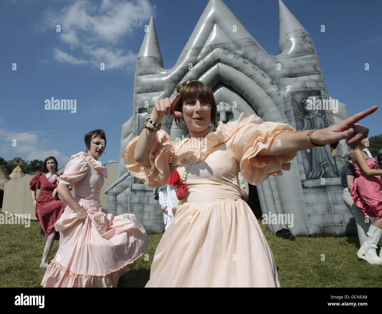 Performers dance outside the inflatable church at the Electric Picnic ...