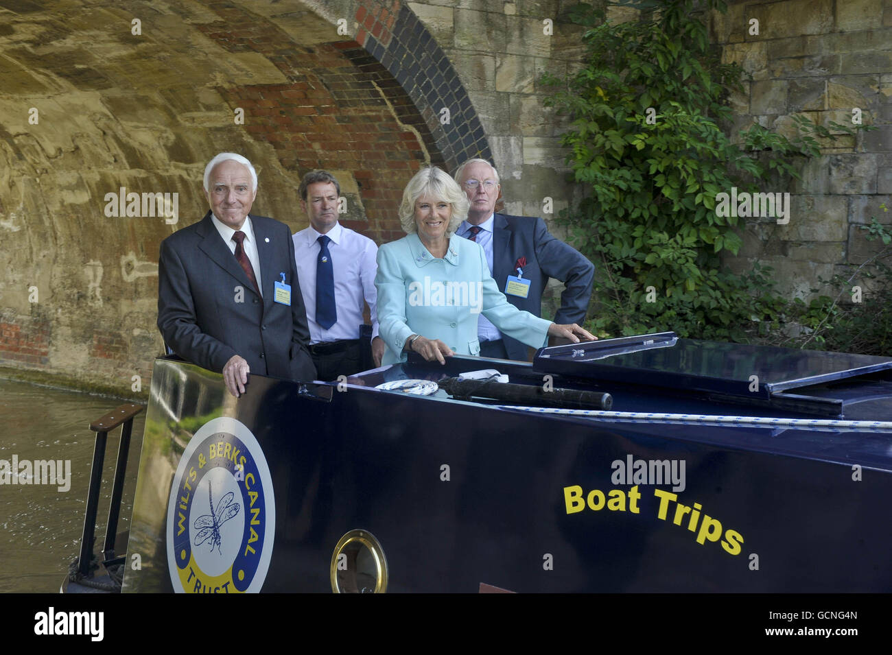 The Duchess of Cornwall steers a narrow trip boat called Dragonfly with ...