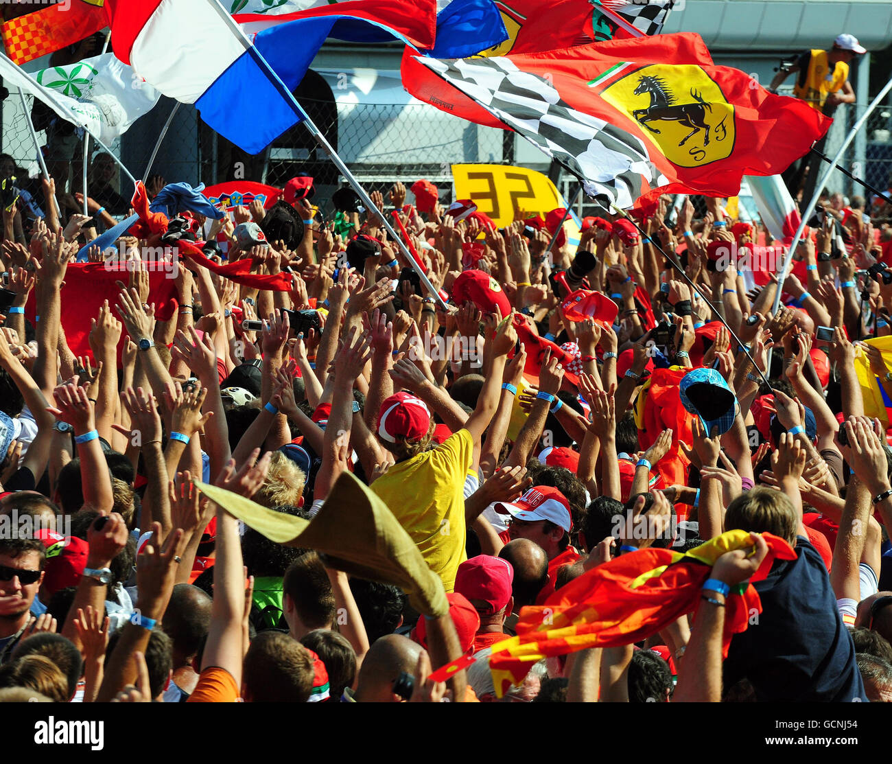 Italian fans celebrate Ferrari's Fernando Alonso of Spain's victory in ...